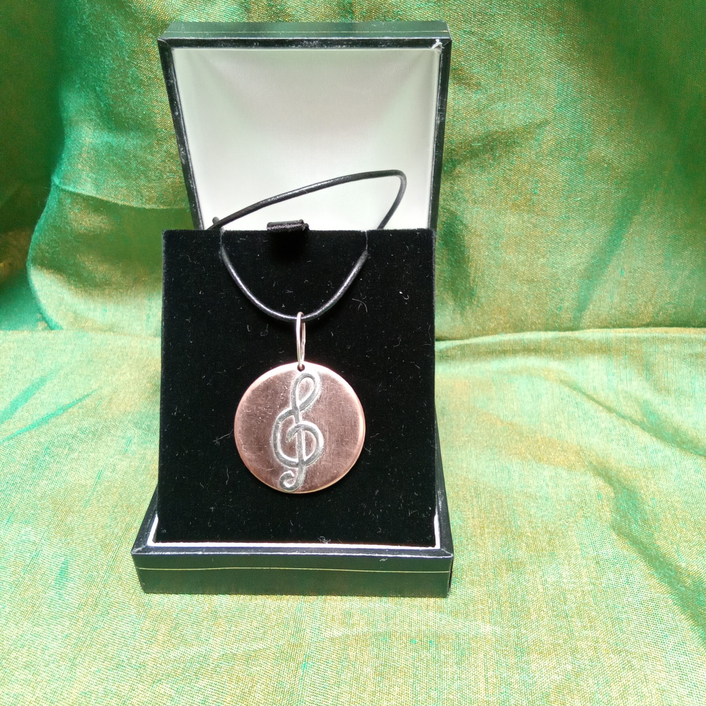 Handcrafted copper pendant with silver treble clef inlay using recycled ...
